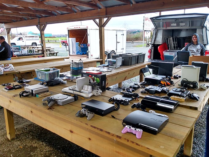 Gaming history displayed across generations—from Atari to PlayStation. The evolution of entertainment laid bare on rough-hewn wooden tables.
