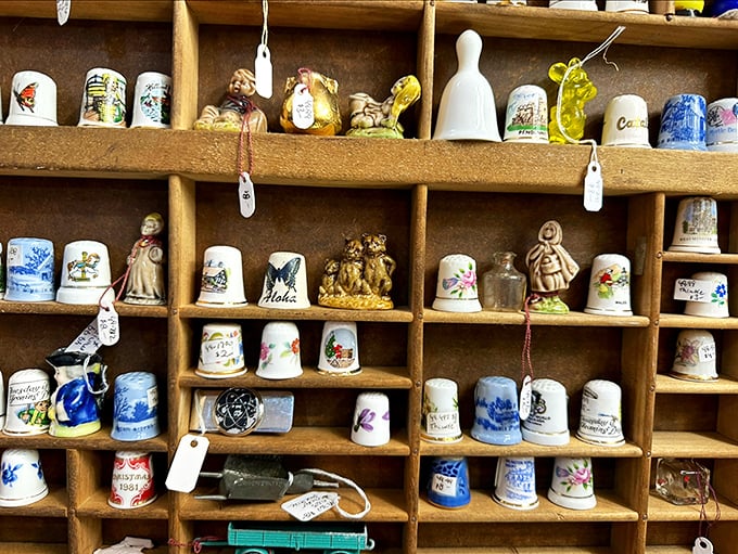 A thimble collector's dream display! Each tiny treasure represents a different place or time—like passport stamps for the sewing enthusiast. 