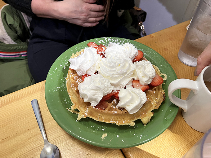 A waffle that's dressed for success. Those strawberries and whipped cream aren't just toppings—they're the breakfast equivalent of putting on your Sunday best.