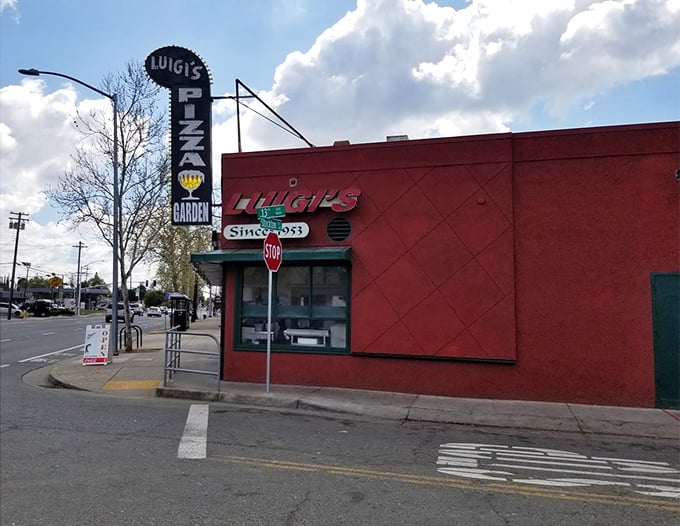 Luigi's vintage sign has guided Sacramento pizza pilgrims for generations. Red building, red sauce, true happiness.