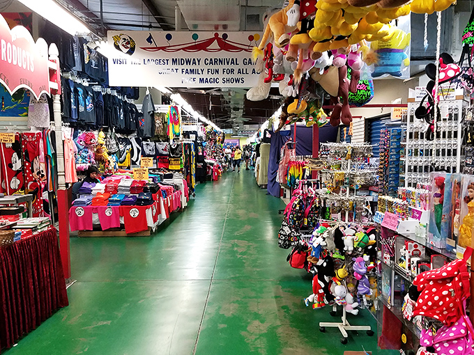 Carnival atmosphere meets serious shopping where stuffed prizes hang overhead like cheerful guardians of great deals below