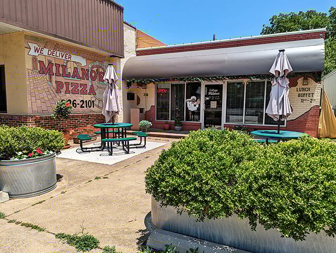 Milano's Pizza: "Small-town charm, big-time flavor. That cheerful red umbrella invites you to slow down and savor!" 