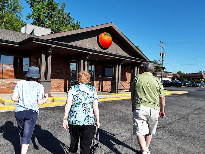 These folks aren't just walking toward Monical's—they're embarking on a quest for that signature sweet sauce and crispy crust.