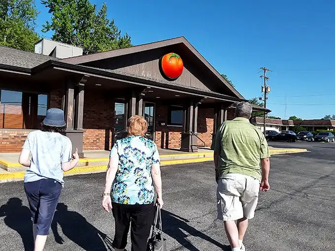 These folks aren't just walking toward Monical's—they're embarking on a quest for that signature sweet sauce and crispy crust.