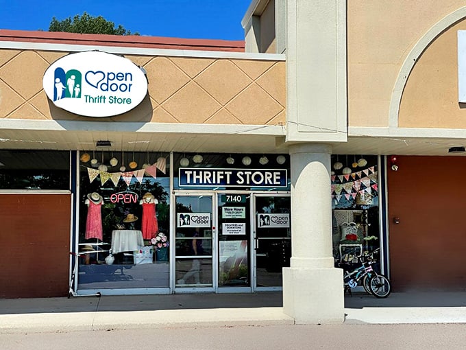 Open Door's charming storefront with festive bunting invites you into a boutique thrifting experience.