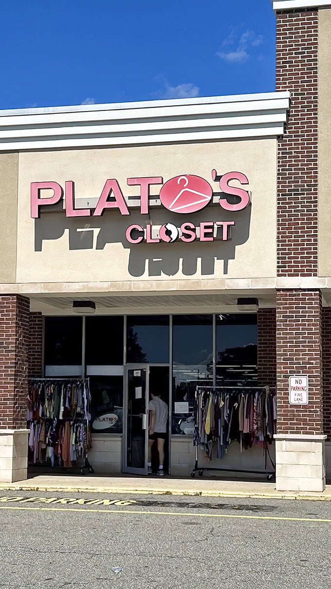 The pink sign beckons like a lighthouse for the fashion-savvy bargain hunter. Treasure awaits inside! 