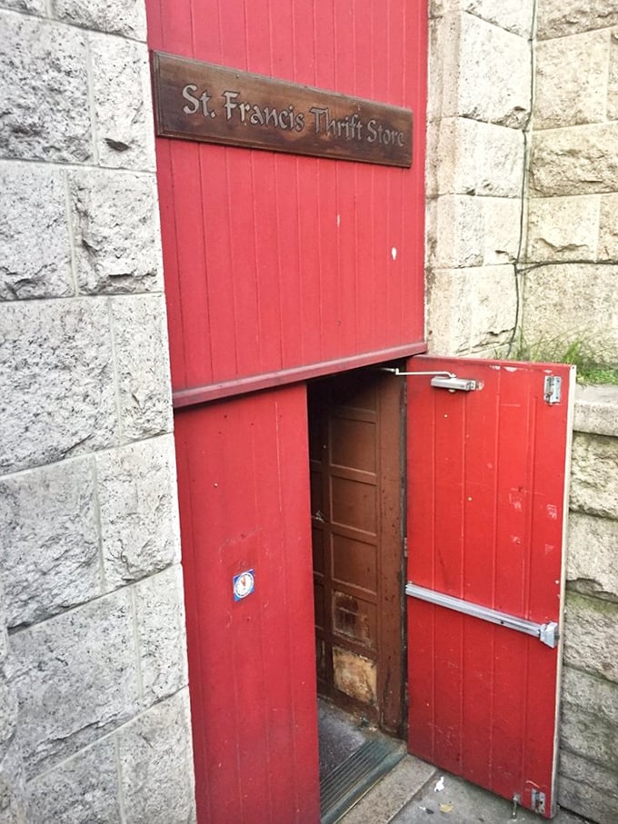 St. Francis' crimson door stands like a secret entrance to Narnia – if Narnia were filled with affordable vintage finds.