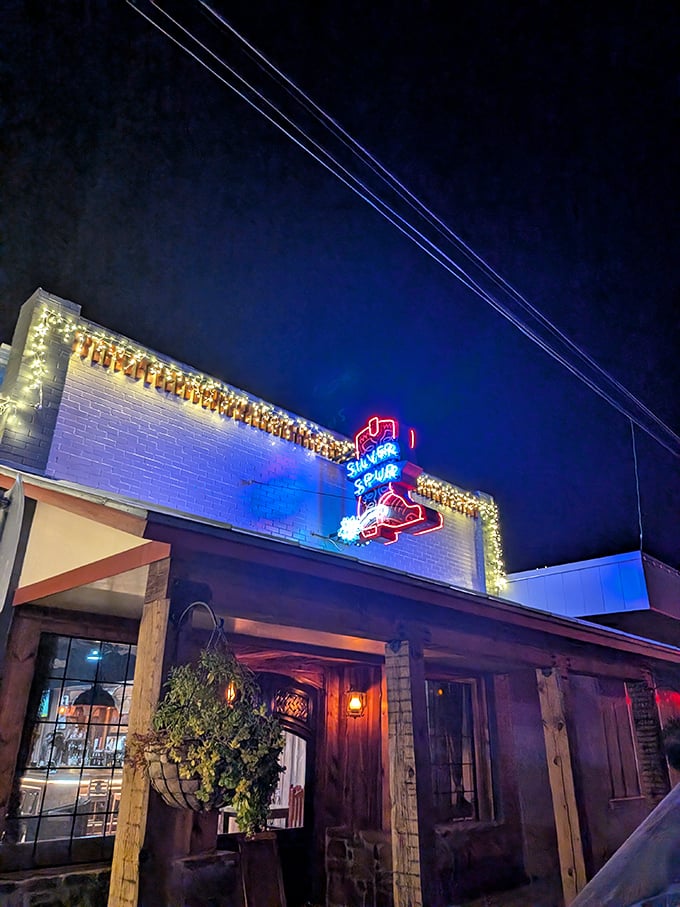 Silver Spur's neon boot sign lights up the night like a Texas-sized welcome mat. Follow the glow to flavor!