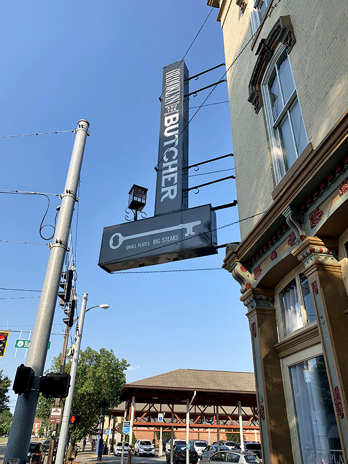 That vertical "BUTCHER" sign isn't just for show—it's pointing the way to some of the finest dry-aged beef in southern Indiana.