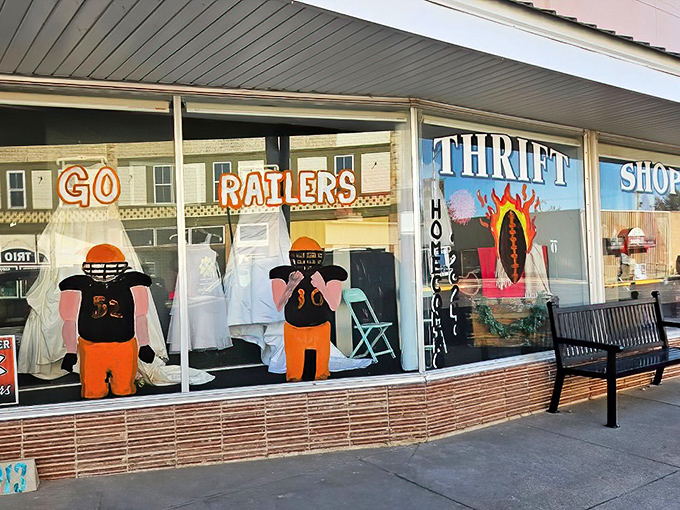 "Go Raiders" spirit fills the windows of this small-town thrift shop—where school pride meets bargain hunting.