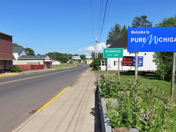 Ironwood's entrance might seem unassuming, but those flags stand proud – welcoming you to some of Michigan's most budget-friendly living.