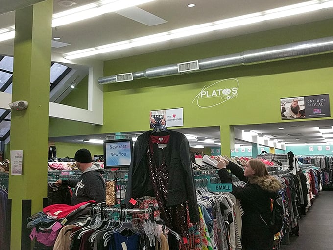 Inside Plato's Closet, a rainbow of carefully organized fashion awaits. The lime green walls are as vibrant as the shopping experience itself.