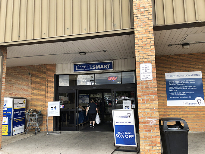 The unassuming entrance belies the organized treasure trove of secondhand goods waiting within.