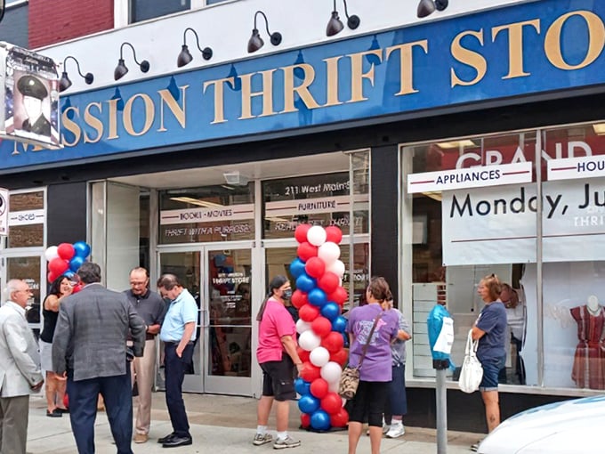 The iconic blue awning of City Mission Thrift Store welcomes bargain hunters with patriotic flair and the promise of treasures within.