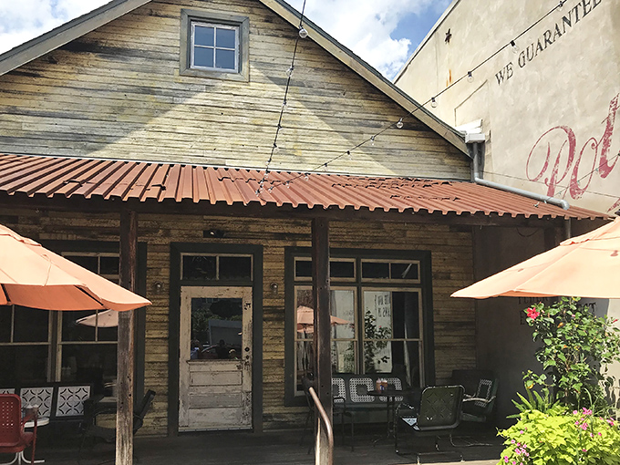 The weathered wooden exterior of Fette Sau beckons like an old friend, promising smoky treasures within its rustic walls.