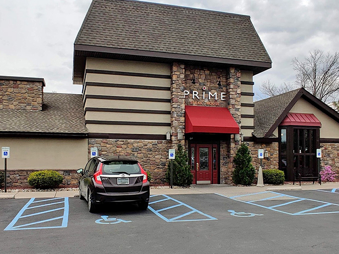 The stone facade of Prime Steak House welcomes hungry travelers with its distinctive red awning—like a beacon of culinary promise in Bethlehem's dining landscape.