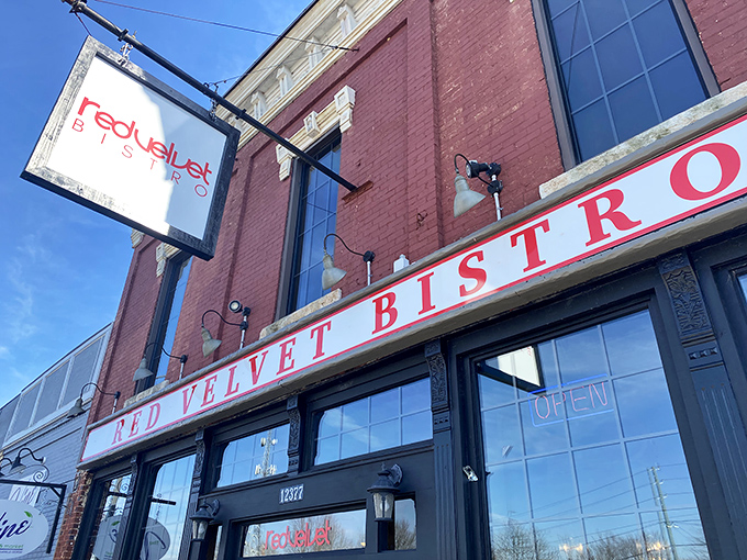 The historic brick façade of Red Velvet Bistro beckons hungry travelers with its classic charm and promise of Southern comfort within.