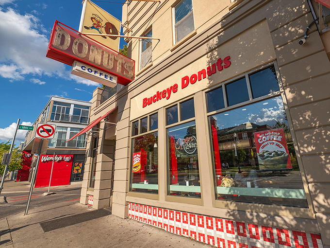 The iconic Buckeye Donuts storefront stands proudly on High Street, its vintage neon sign a beacon of hope for the hungry at any hour.