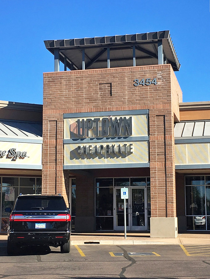 The sleek brick storefront of Uptown Cheapskate promises fashion treasures within – like finding the retail promised land without sacrificing your retirement fund.