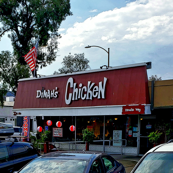 That iconic red awning and vintage signage isn't just decoration—it's a time portal to when comfort food reigned supreme and calories didn't count.