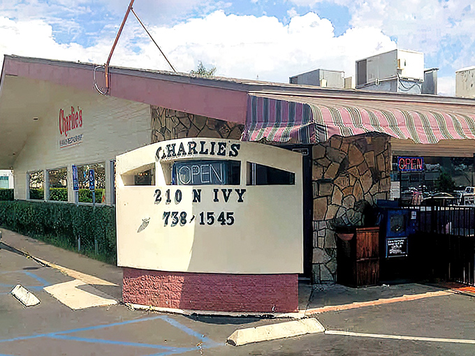 Charlie's iconic exterior stands as a time capsule of classic Americana dining, complete with stone façade and vintage signage.