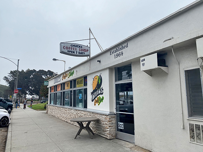 Palm trees and blue skies frame Chuck's Coffee Shop, where the "FOOD TO GO" sign has been beckoning hungry Long Beach locals for generations.