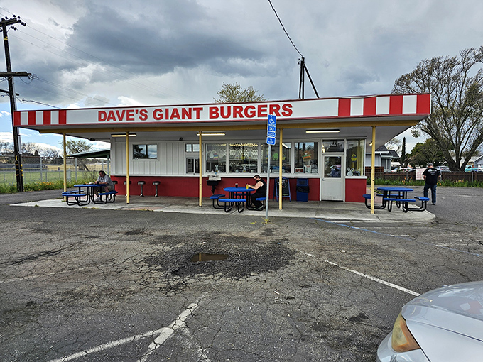 The red and white striped awning of Dave's isn't just a design choice—it's a beacon calling hungry travelers home to burger paradise.
