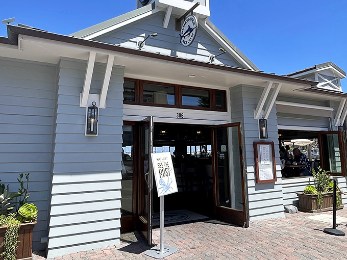 The crisp white exterior of Bluewater Avalon beckons like a maritime mirage, promising seafood treasures within its nautical-themed walls.