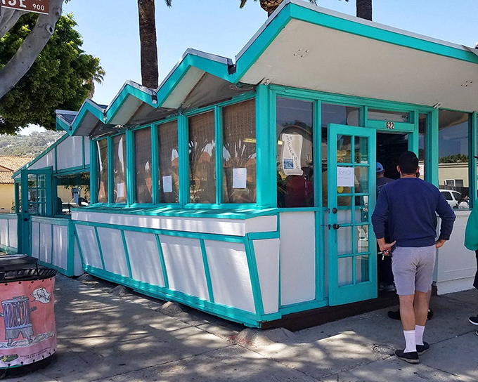 This turquoise treasure on Milpas Street proves that culinary gold often hides behind humble facades.