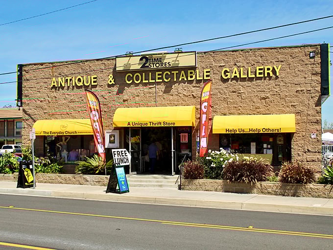The stone facade and bright yellow awnings of 2nd Time Store stand like a beacon for treasure hunters in Tustin, promising adventures in secondhand shopping.