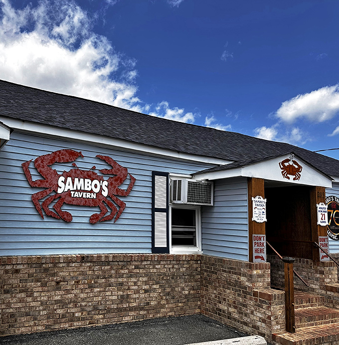 The iconic blue exterior with that rusty crab sign practically screams "seafood sanctuary." No fancy architects needed when you've got decades of delicious reputation.