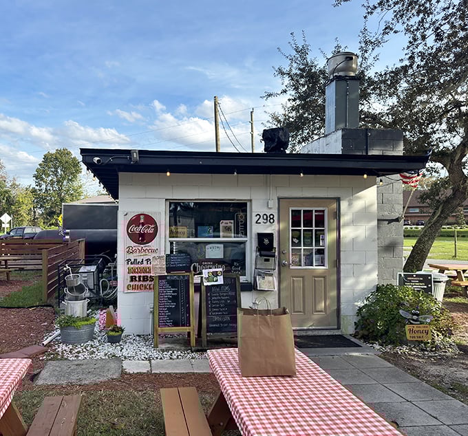 The unassuming white shack with twin smoker chimneys stands like a barbecue beacon in Oviedo. Yellow mums and a wooden ramp welcome meat pilgrims to BBQ paradise.