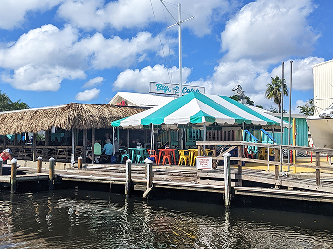 The turquoise facade of The Big Catch at Salt Creek isn't trying to hide – it's proudly announcing that Florida seafood paradise awaits inside.