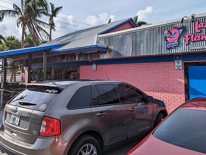 The pink and blue exterior of The Lazy Flamingo stands out like a flamingo at a penguin convention—Florida casual at its finest.