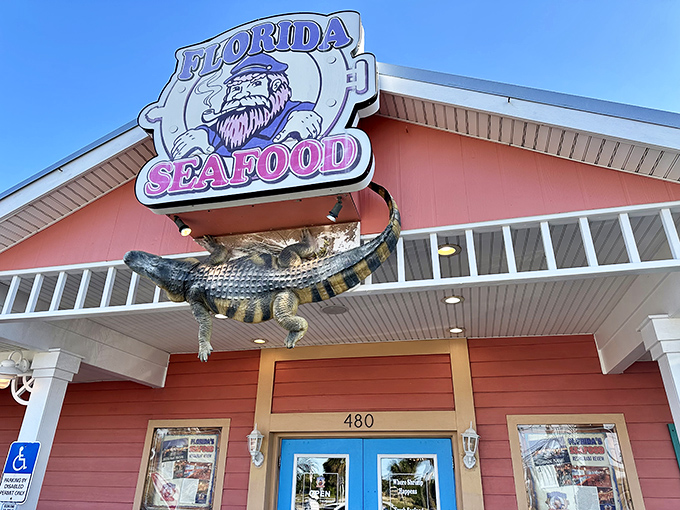 The coral-colored beacon of Florida's Seafood Bar & Grill stands out against the Cocoa Beach sky, promising seafood treasures that locals have been quietly hoarding for themselves.