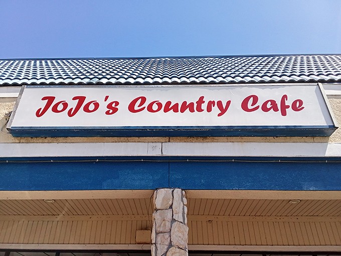 The blue roof beckons like a Florida sky, promising comfort beneath. JoJo's Country Cafe sits unassumingly in this Deltona strip mall, a hidden breakfast treasure waiting to be discovered.