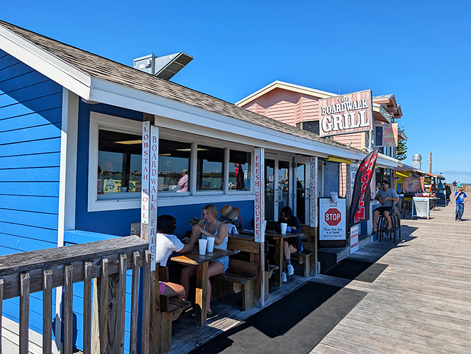 The weathered wooden exterior of Boardwalk Grill stands as a beacon of authentic Florida seafood. No pretension, just the promise of honest coastal cooking.