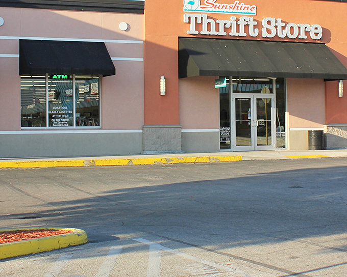 The coral-colored exterior of Sunshine Thrift beckons like a siren song to bargain hunters. A thrifter's paradise awaits behind those unassuming glass doors.