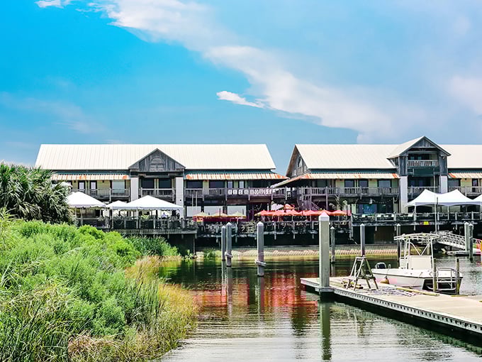 The Fish House stands like a coastal postcard come to life, with its waterfront perch offering diners front-row seats to Pensacola Bay's daily show.