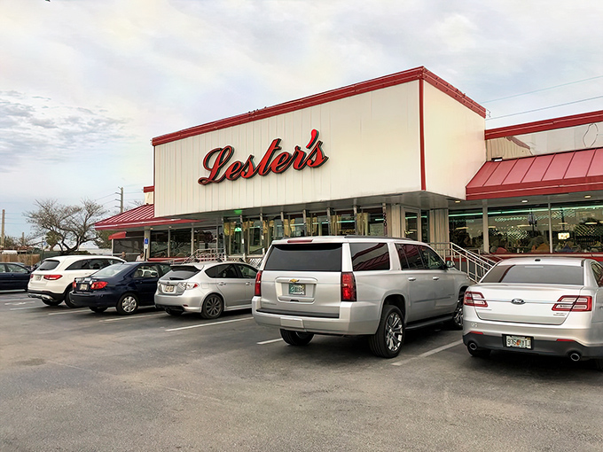 Lester's iconic white and red exterior stands like a beacon of breakfast hope on State Road 84, promising comfort food salvation to hungry Floridians.