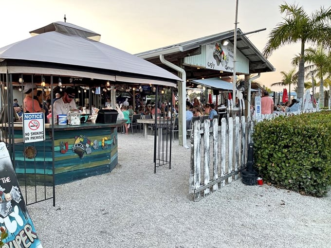 The Ugly Grouper's cheerful exterior belies its name, welcoming hungry beachgoers with tropical vibes and the promise of seafood paradise.