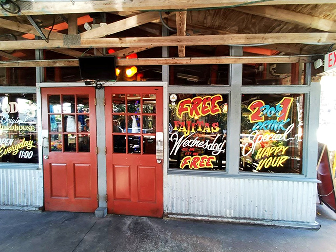 The classic roadhouse exterior beckons with its vintage sign and sunny yellow patio wall—Florida's answer to "come as you are, leave happier than you arrived."