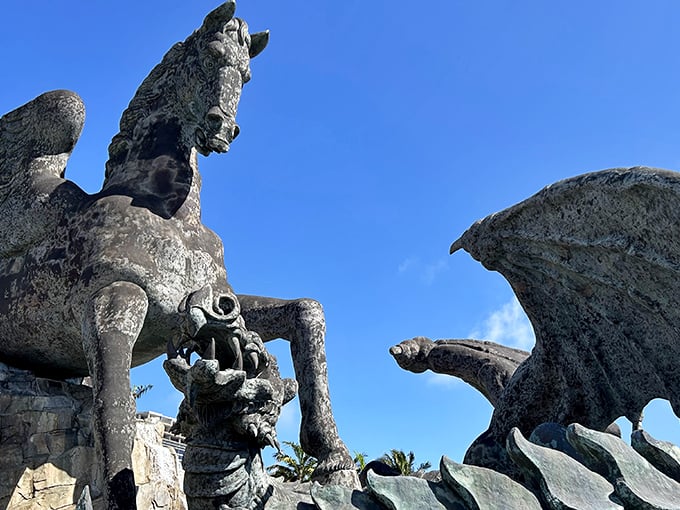 The epic showdown between Pegasus and Dragon unfolds in bronze and stone, like mythology's greatest heavyweight match frozen in time.