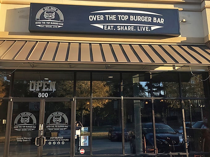 The blue signage beckons like a lighthouse for the hungry. "Eat. Share. Live." isn't just a motto—it's a survival strategy.
