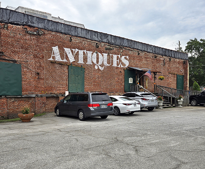 The brick facade with its bold "ANTIQUES" lettering isn't just advertising—it's a siren call to treasure hunters and nostalgia seekers alike.