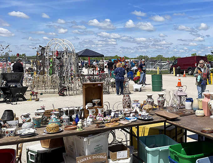 A treasure hunter's paradise stretches before you – tables laden with potential discoveries under the vast ceiling of possibility. Every aisle promises its own adventure.