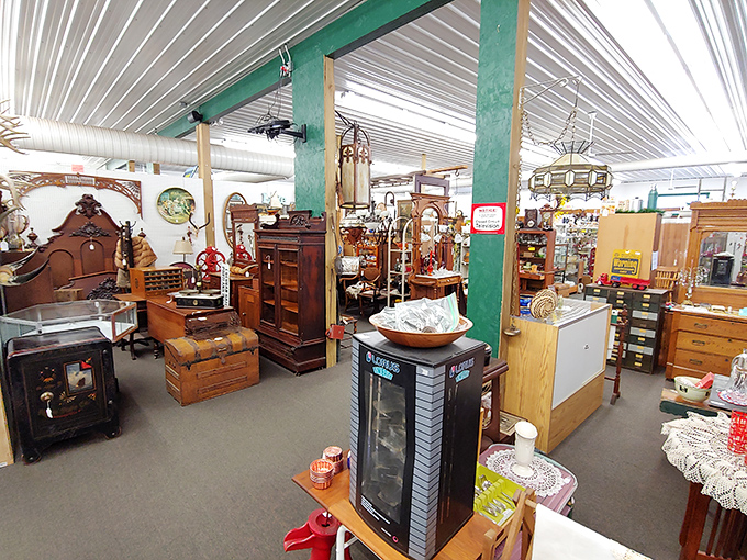 The warm wooden interior of Hog Creek Antique Mall beckons treasure hunters with its labyrinth of vendor booths—a paradise where history whispers from every shelf.
