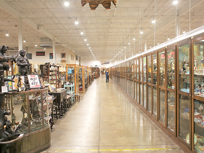 The stately entrance to Relics beckons with its distinctive peaked roof and warm brick facade—a modest portal to an extraordinary world of vintage treasures within.