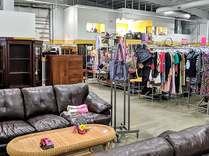 Treasure hunters navigate a sea of clothing racks under soaring ceilings. This isn't just shopping—it's an expedition with purpose.
