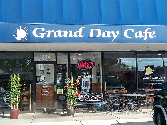 The classic blue awning of Grand Day Cafe stands as a beacon of breakfast hope in this Columbus strip mall—proof that culinary treasures often hide in plain sight.
